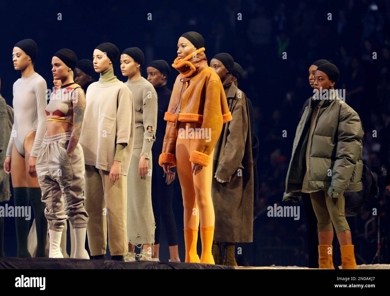 Models wear fashion from the Yeezy collection at a presentation and ...