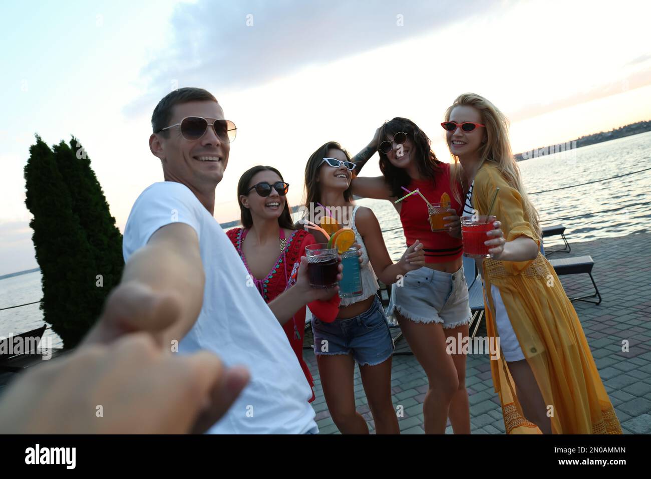 Group of happy people enjoying fun party outdoors Stock Photo - Alamy