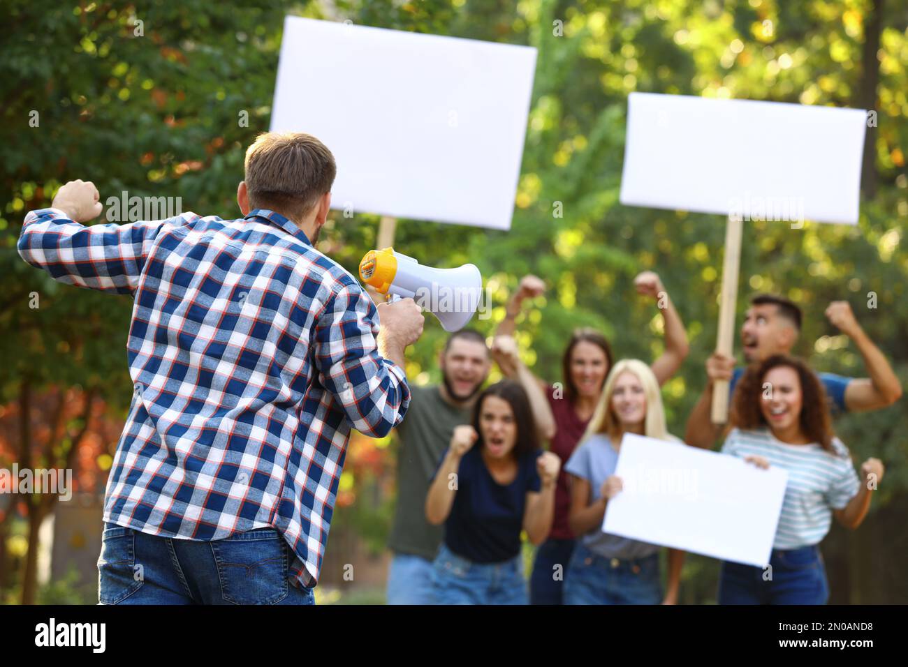Protest leader with megaphone talking to crowd outdoors Stock Photo - Alamy Protest leader with megaphone talking to crowd outdoors Stock Photo - Alamy
