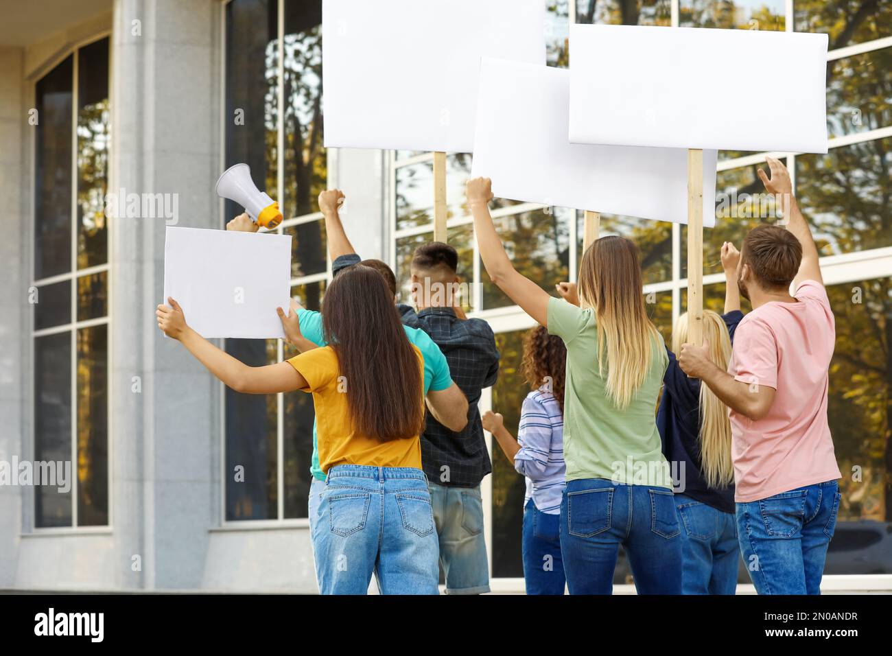 Group of people protesting outdoors, back view Stock Photo - Alamy