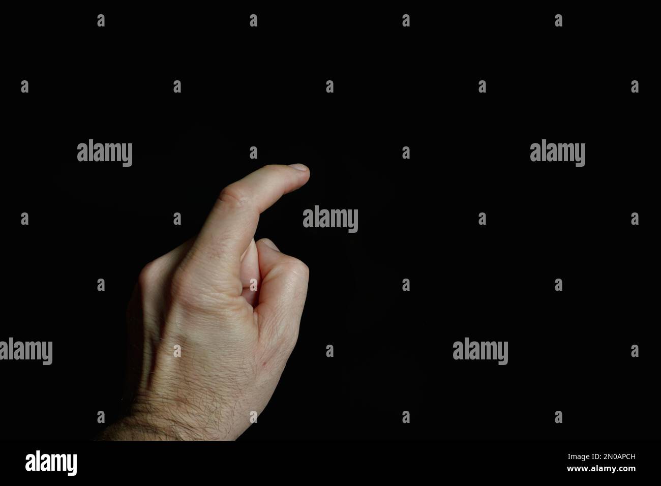 index finger pointing at the screen, black background Stock Photo - Alamy