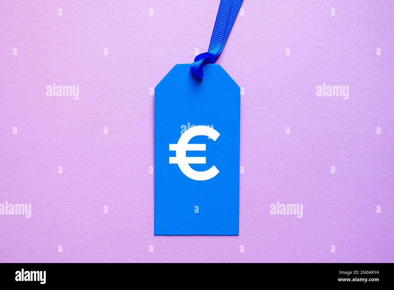 euro sign on the blue price tag for sales Stock Photo - Alamy