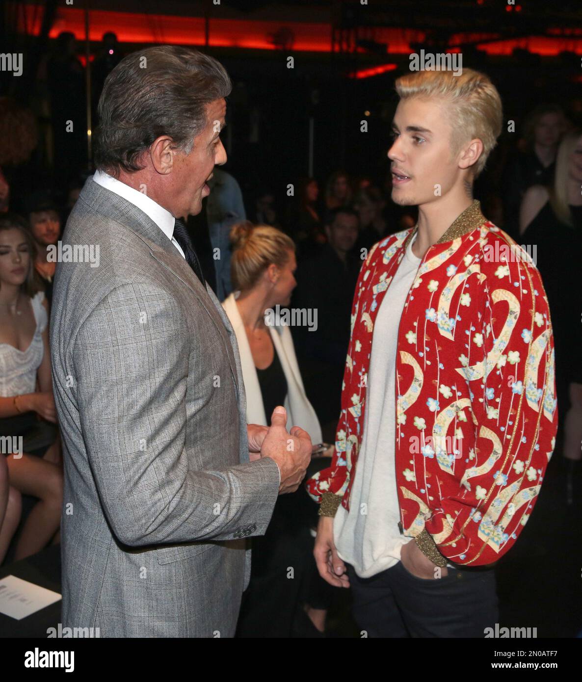 Sylvester Stallone, left, and Justin Bieber attend Saint Laurent at the ...