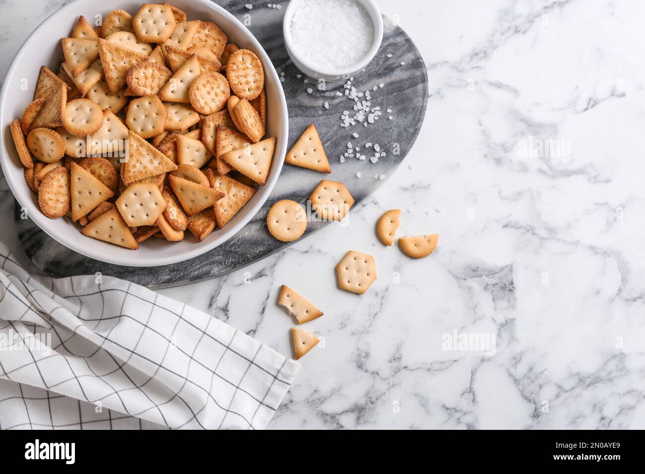 Delicious crispy crackers on white marble table, flat lay Stock Photo ...