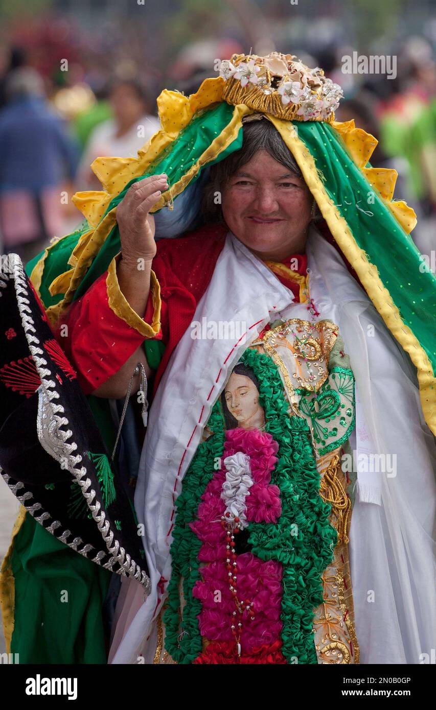 FILE - In this Dec. 11, 2014 file photo, Anarita Ruelas, wearing her ...
