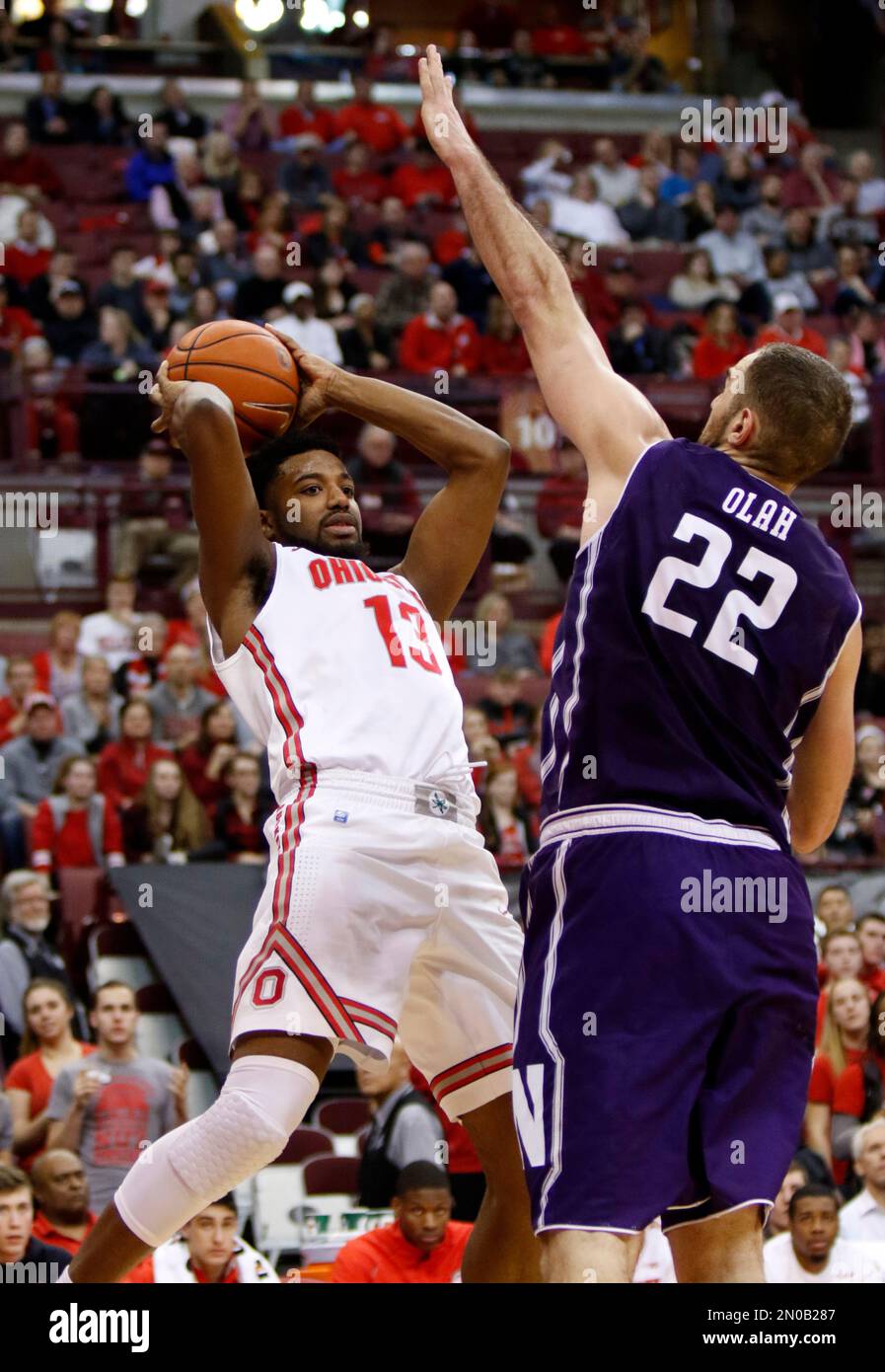 Ohio State's JaQuan Lyle, left, works against Northwestern's Alex Olah ...