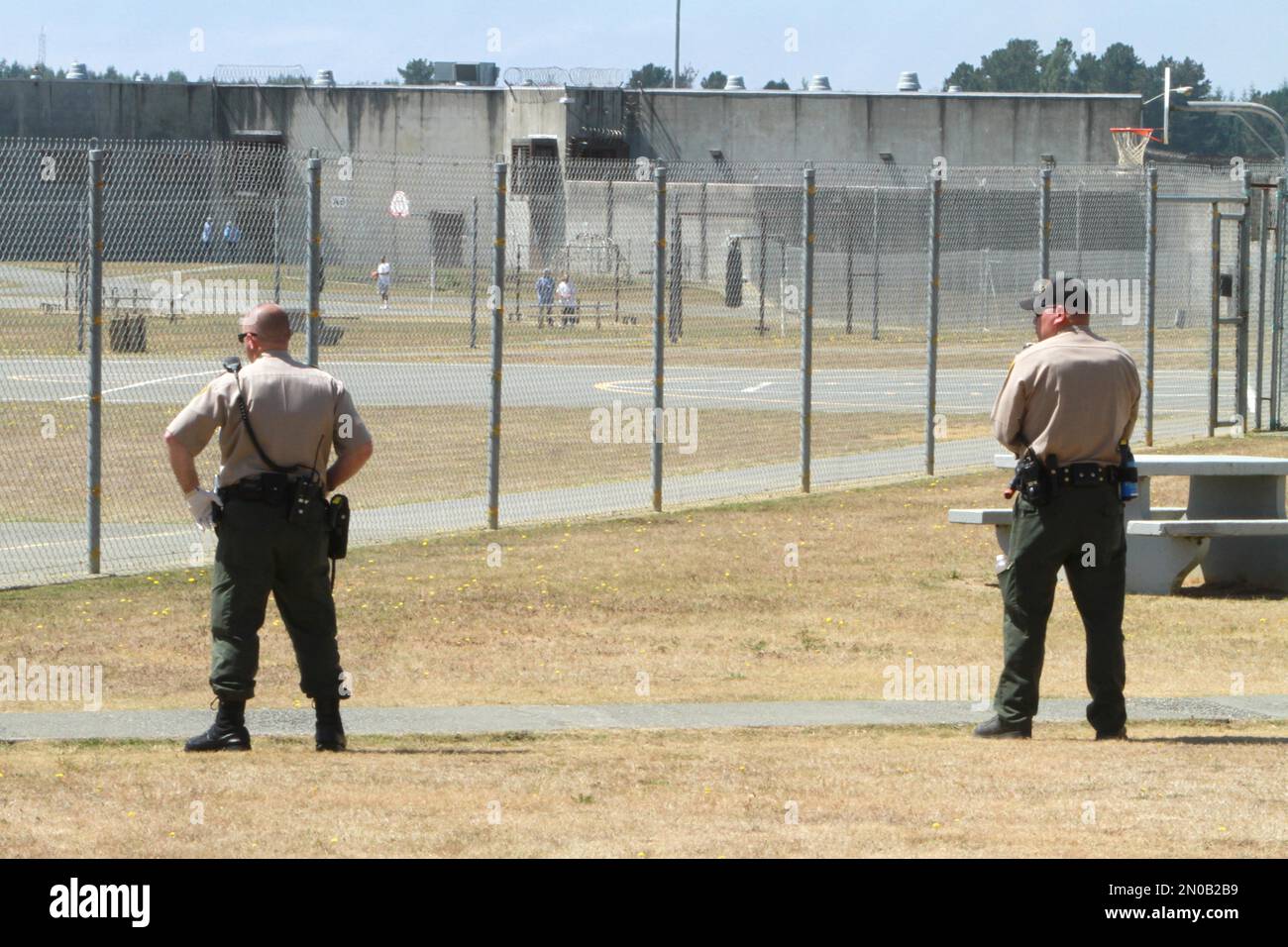 FILE In this Aug. 17, 2011 file photo, correctional officers keep watch ...