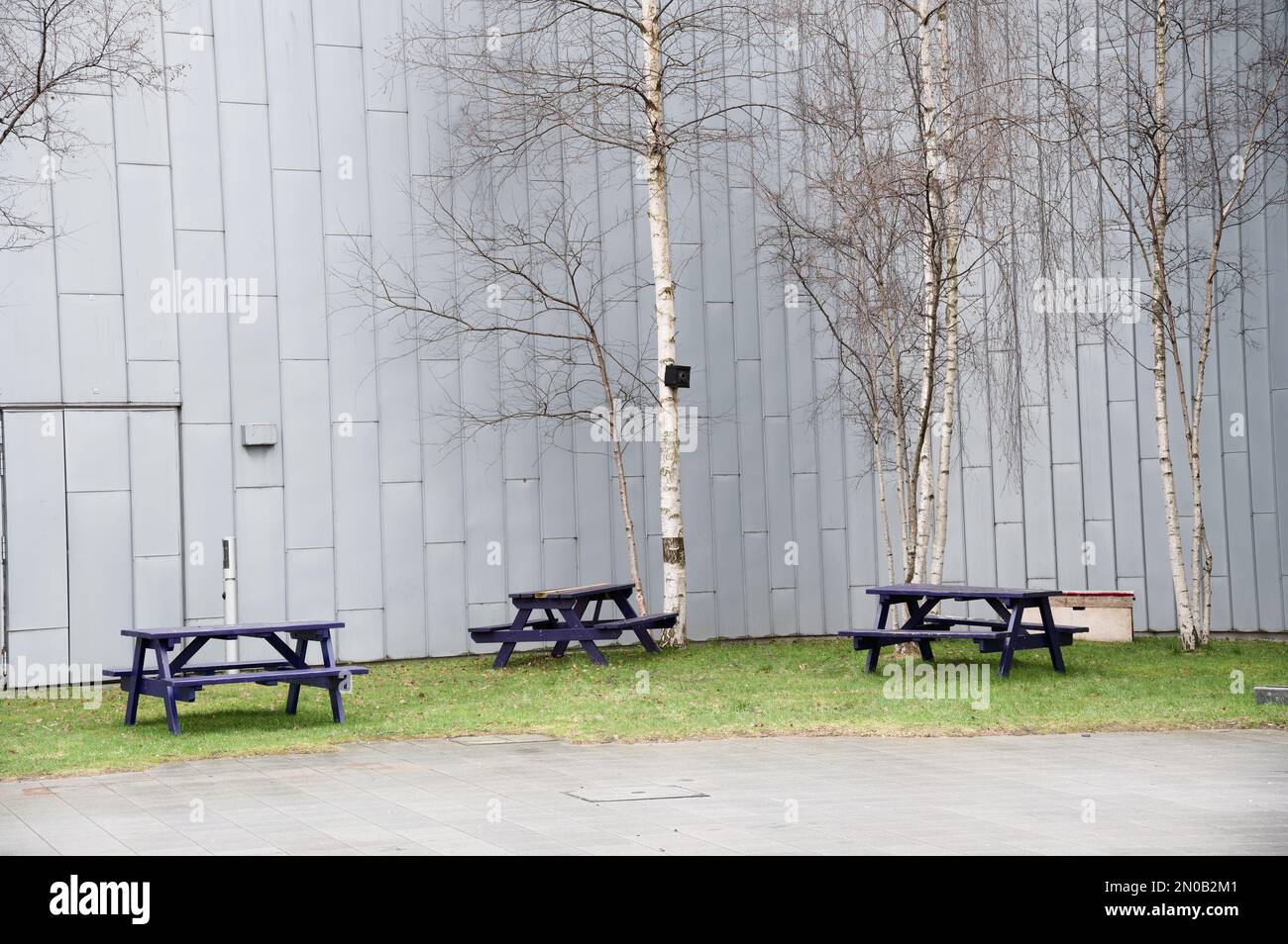 Peaceful view of lonely empty seats at public park Stock Photo - Alamy