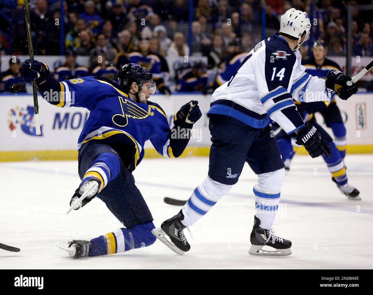 St. Louis Blues' David Backes, left, falls after colliding with ...