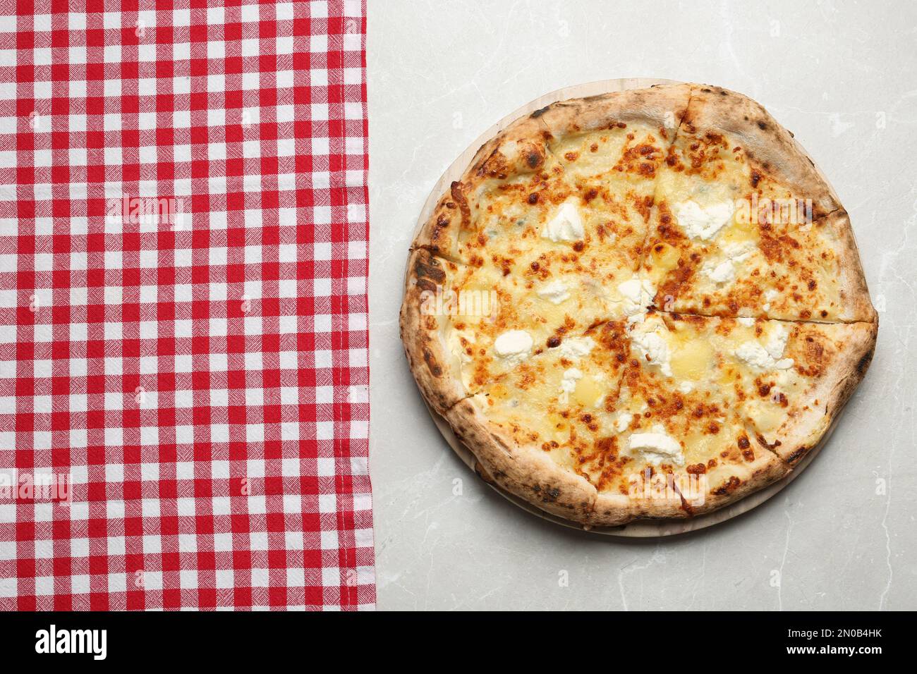 Tasty cheese pizza on light marble table, top view. Space for text ...
