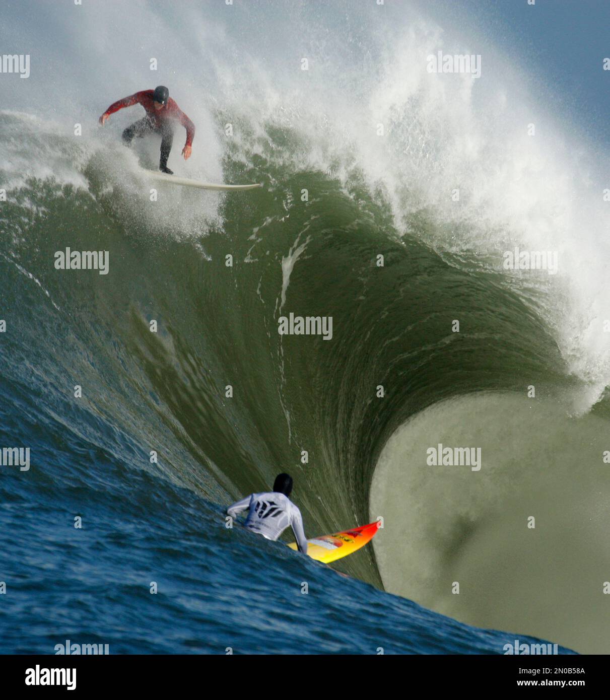 FILE - In this Feb. 13, 2010, file photo, Evan Slater, top, surfs a ...