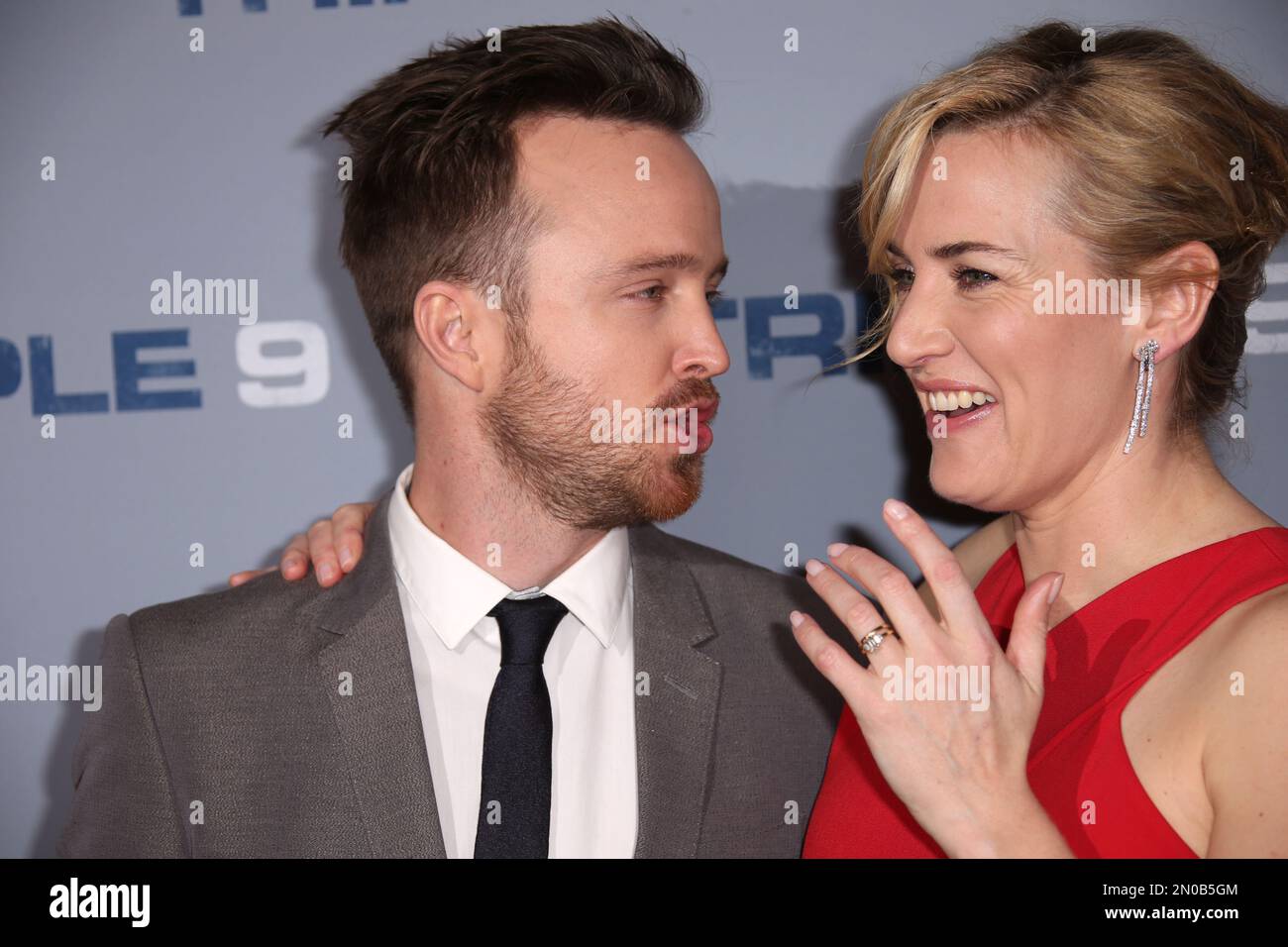 Actors Kate Winslet, right, and Aaron Paul pose for photographers upon ...