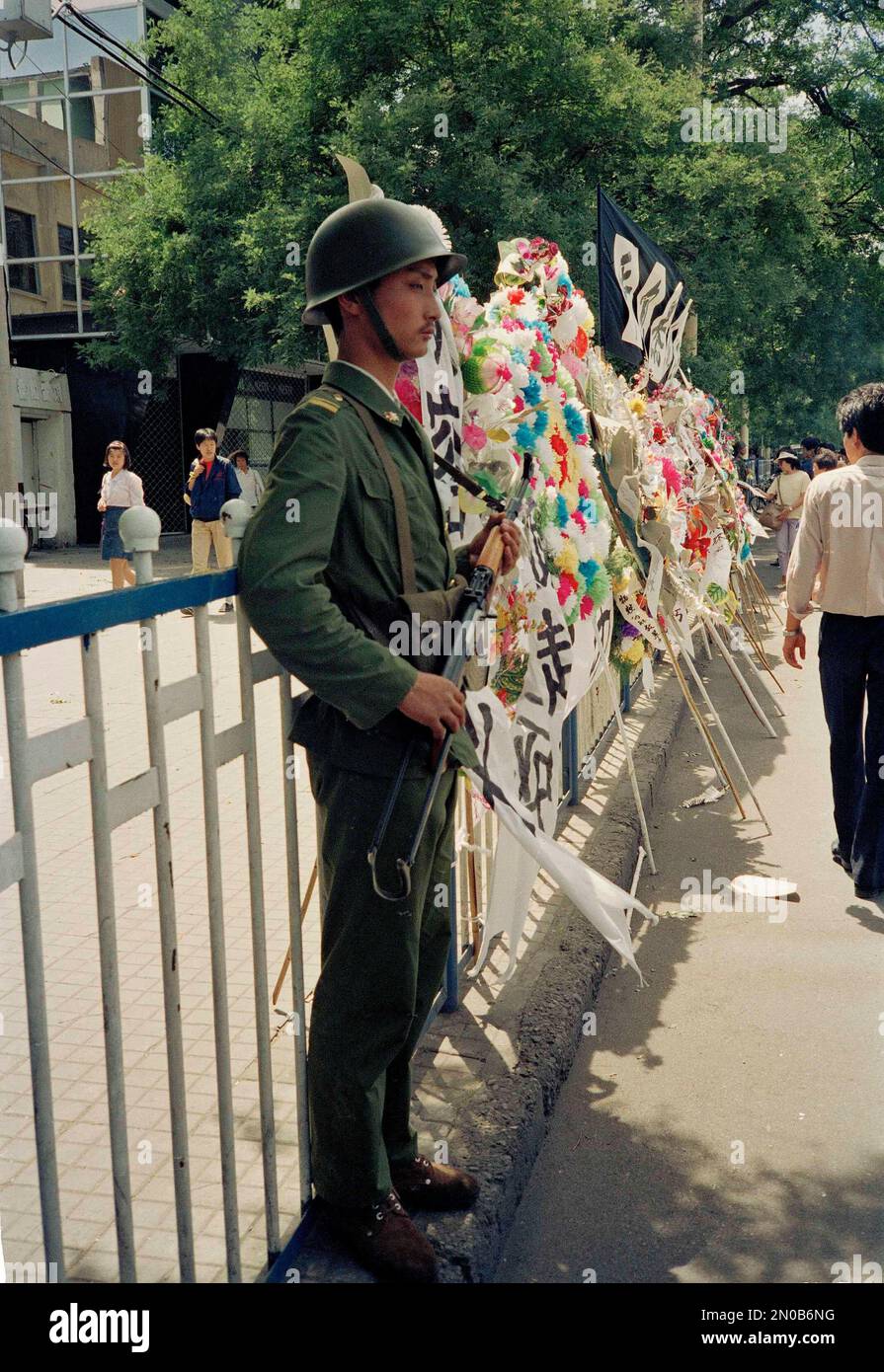 A soldier stands guard at a memorial to PLA troops killed and injured ...