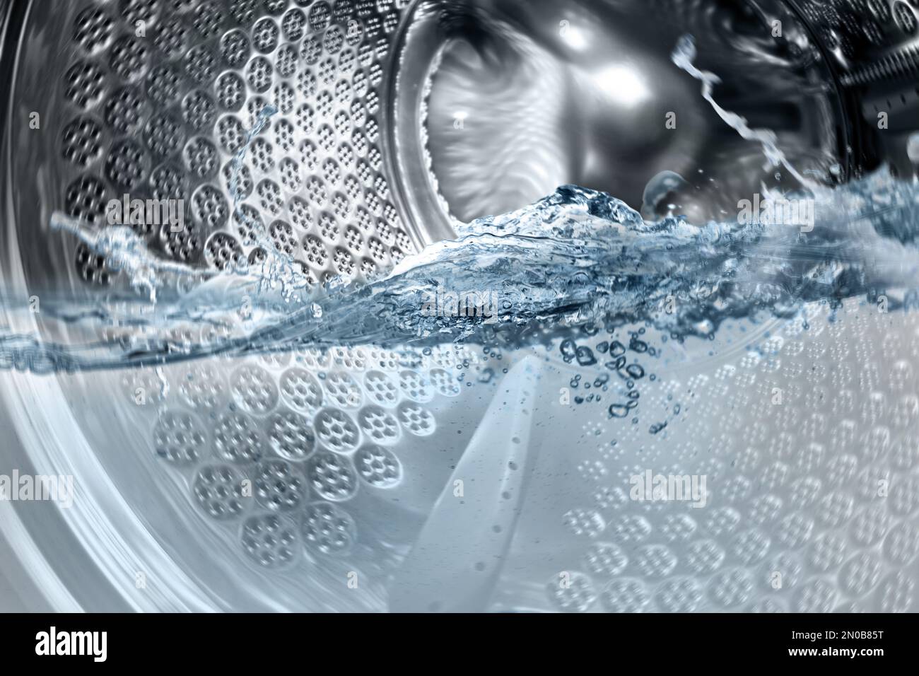 Washing machine drum with water, closeup view Stock Photo - Alamy