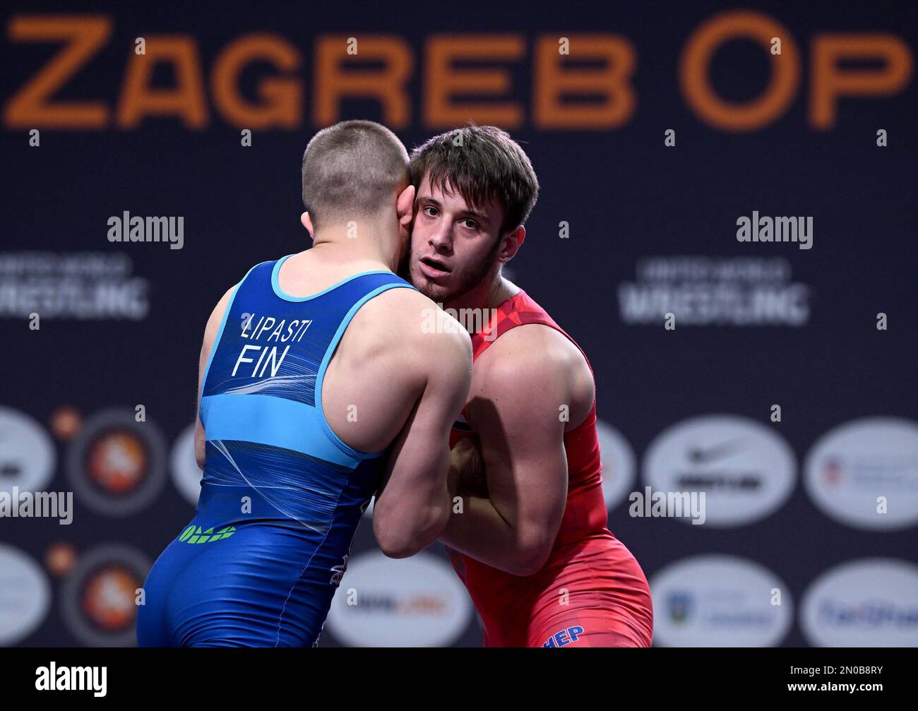 ZAGREB, CROATIA – FEBRUARY 05: Luka Malobabic of Croatia (red) competes ...