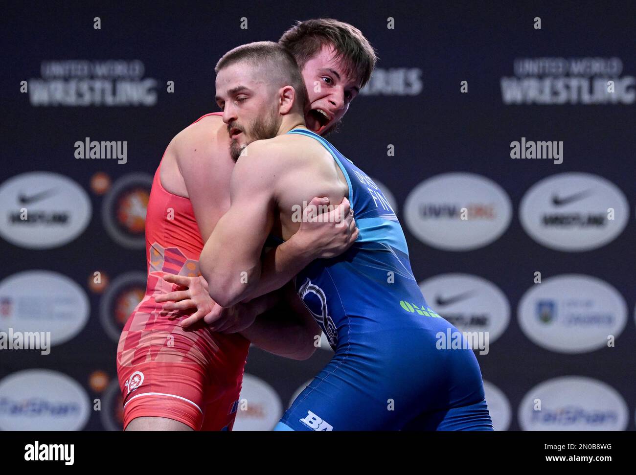 ZAGREB, CROATIA – FEBRUARY 05: Luka Malobabic of Croatia (red) competes ...