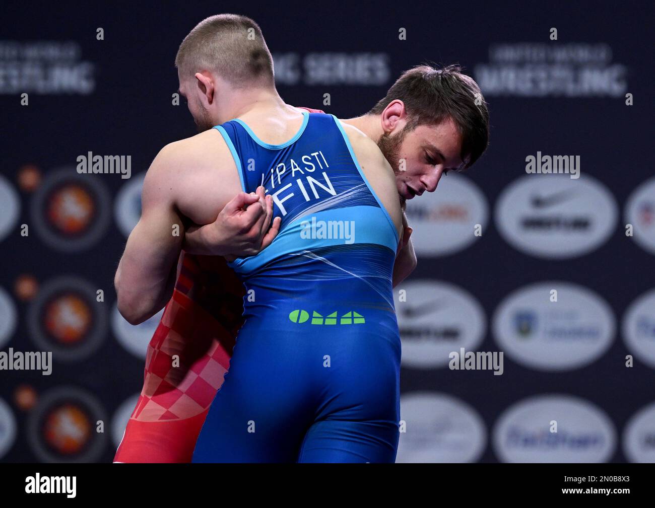 ZAGREB, CROATIA – FEBRUARY 05: Luka Malobabic of Croatia (red) competes ...