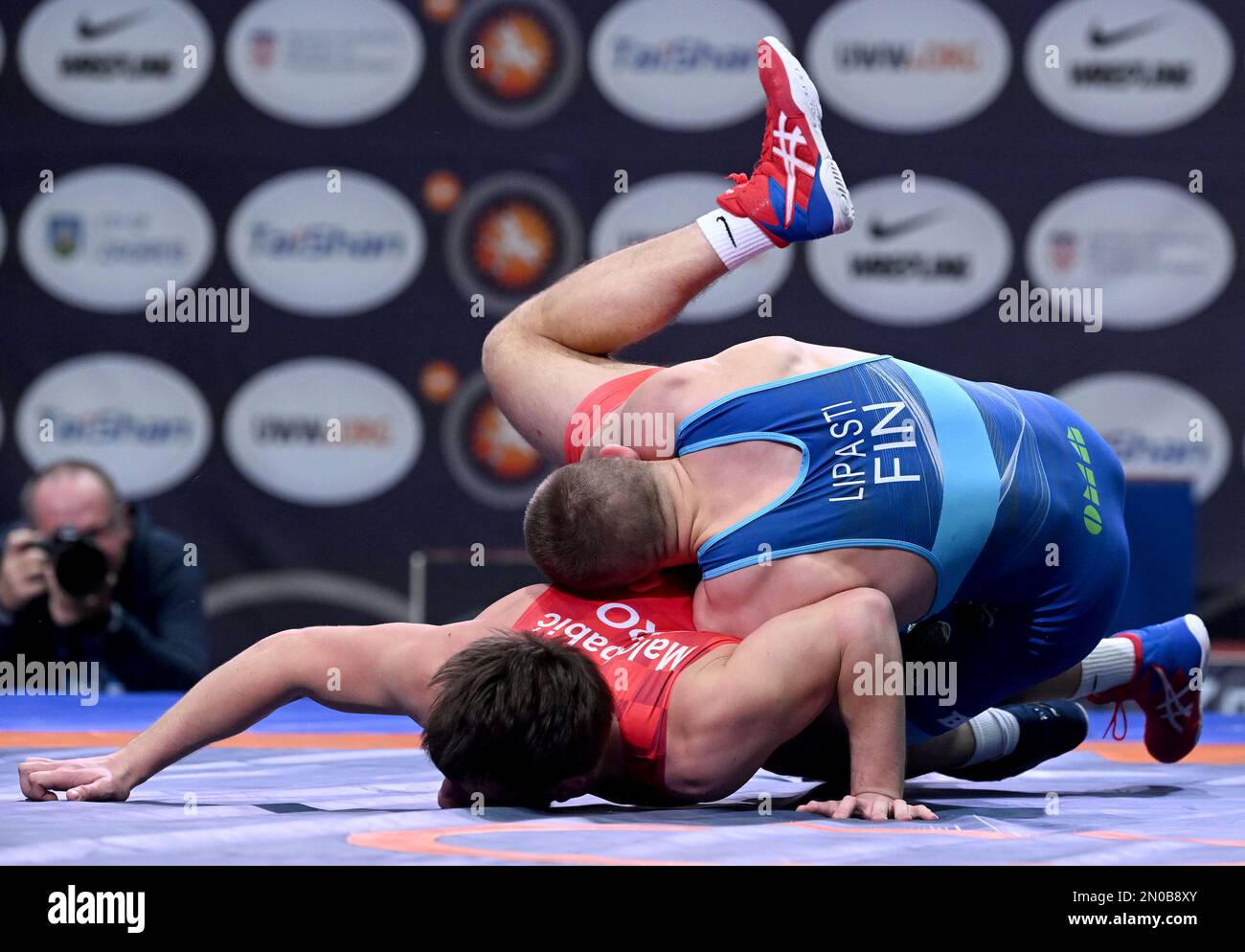 ZAGREB, CROATIA – FEBRUARY 05: Luka Malobabic of Croatia (red) competes ...