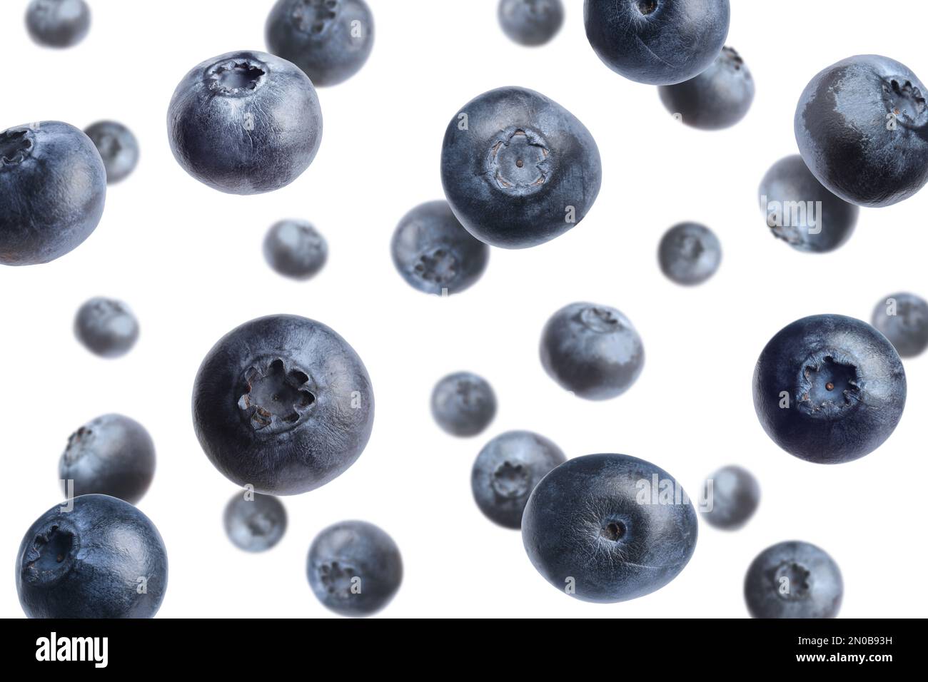 Fresh whole blueberries falling on white background Stock Photo - Alamy
