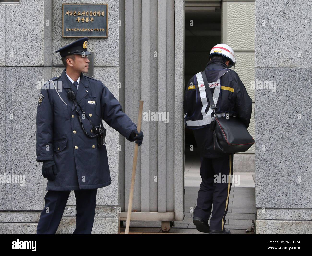A postman enters the headquarters of the pro-Pyongyang General ...