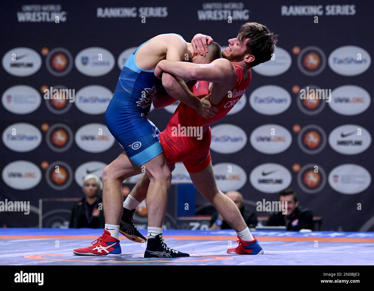 ZAGREB, CROATIA – FEBRUARY 05: Luka Malobabic of Croatia (red) competes ...