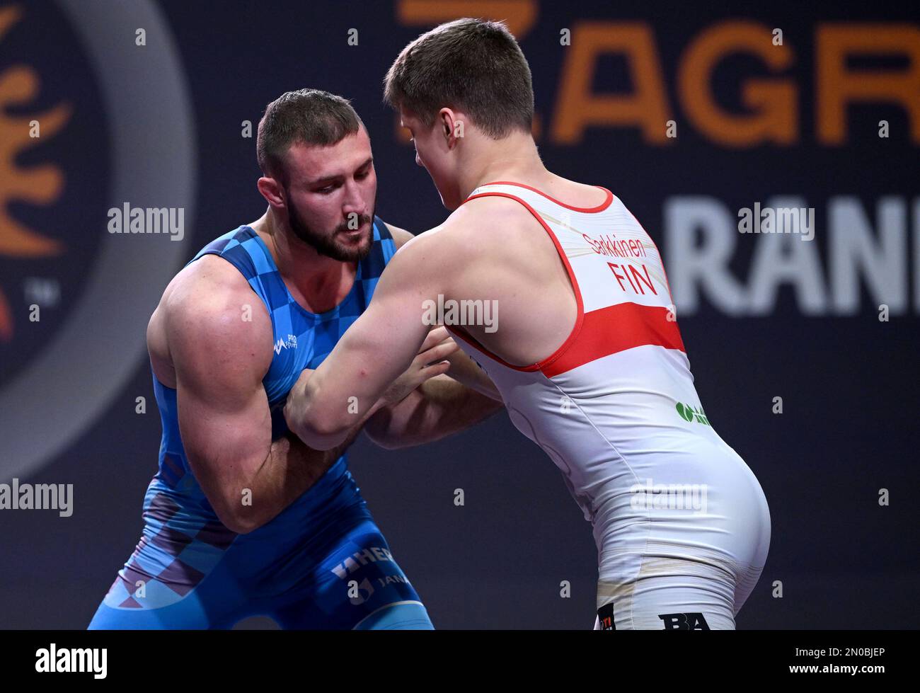 ZAGREB, CROATIA – FEBRUARY 05: Filip Sacic of Croatia (blue) competes ...