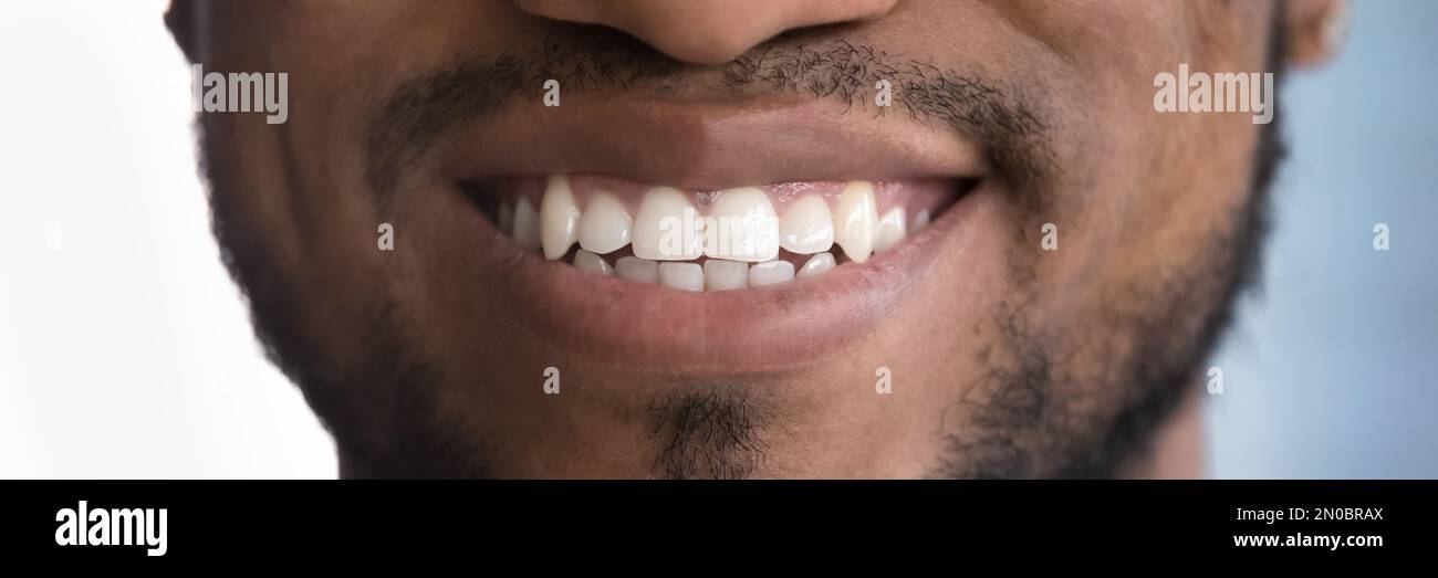 Happy African man posing with toothy smile, showing white teeth Stock ...