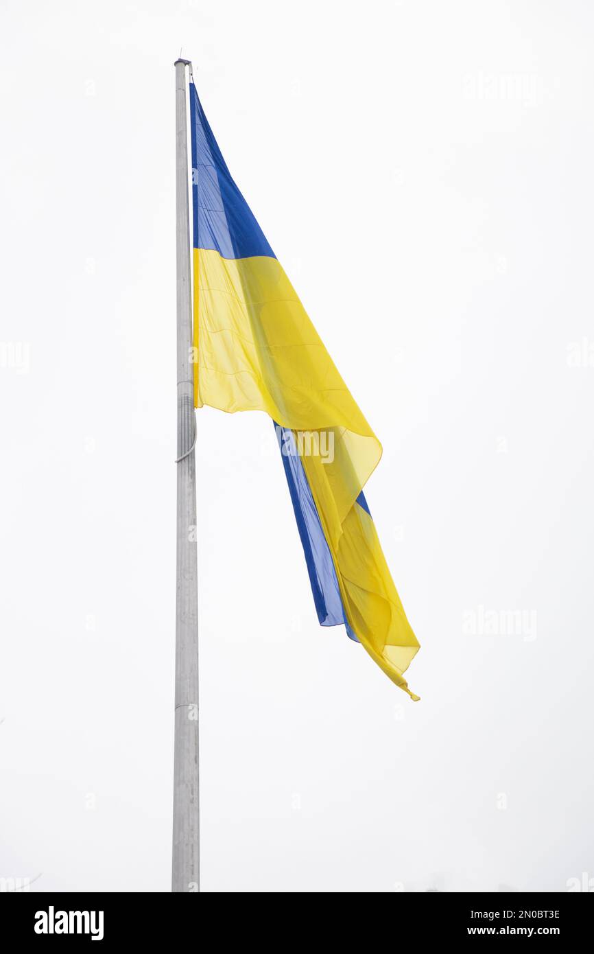 The flag of Ukraine in the city of Dnipro against the sky during the ...