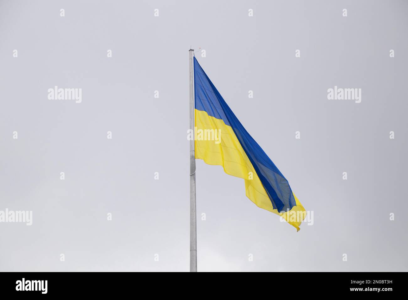 The flag of Ukraine in the city of Dnipro against the sky during the ...