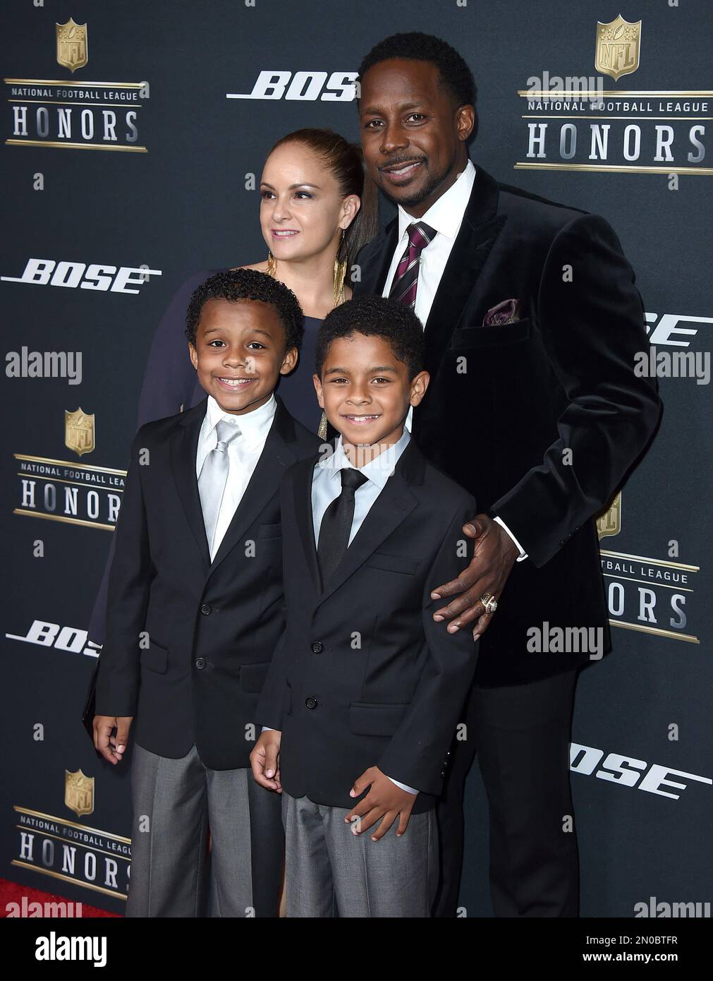 Rebkah Howard, left, former NFL player Desmond Howard, right, and their ...