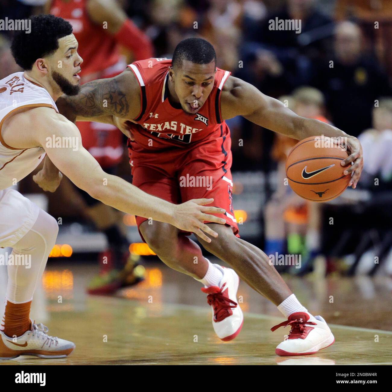 Texas Tech guard Toddrick Gotcher (20) is pressured by Texas guard ...