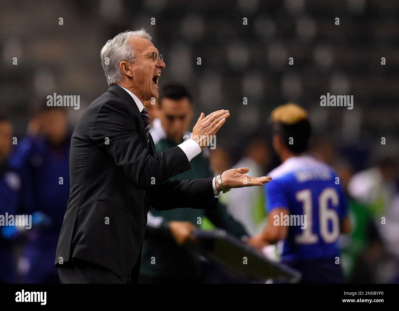 Canada head coach Benito Floro yells to his team during the second half ...