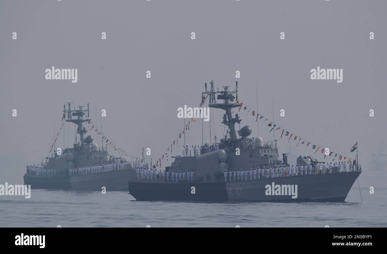 Indian sailors on veer class corvettes take their caps in their hand as ...