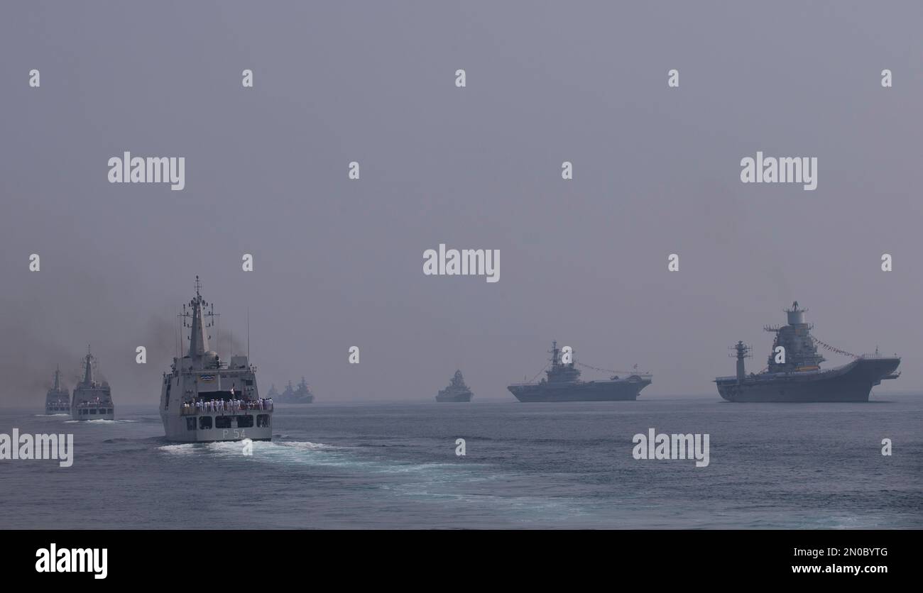 A column of Indian naval ships on the left, with the first ship ...