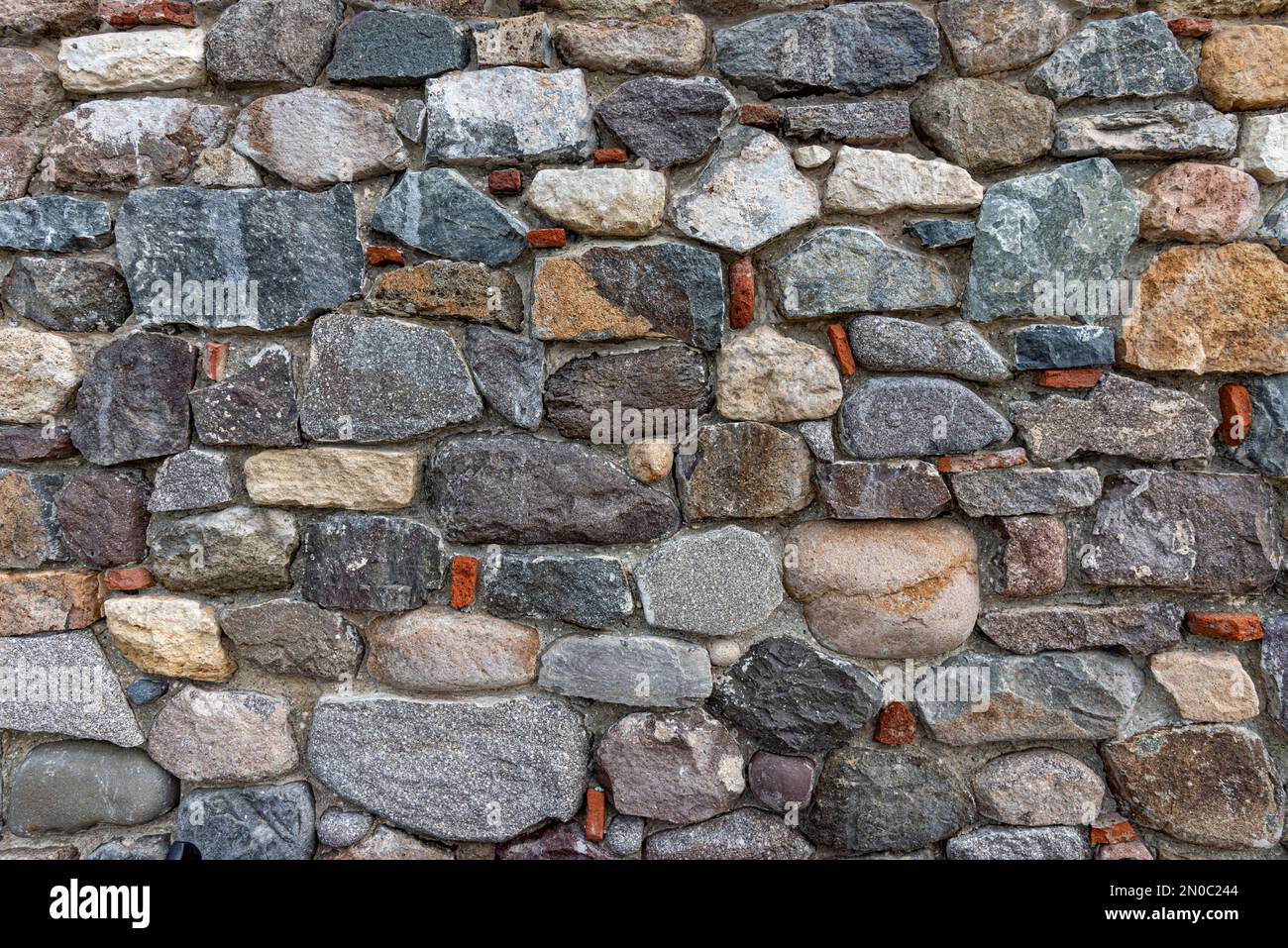 Stone masonry wall as an background Stock Photo - Alamy