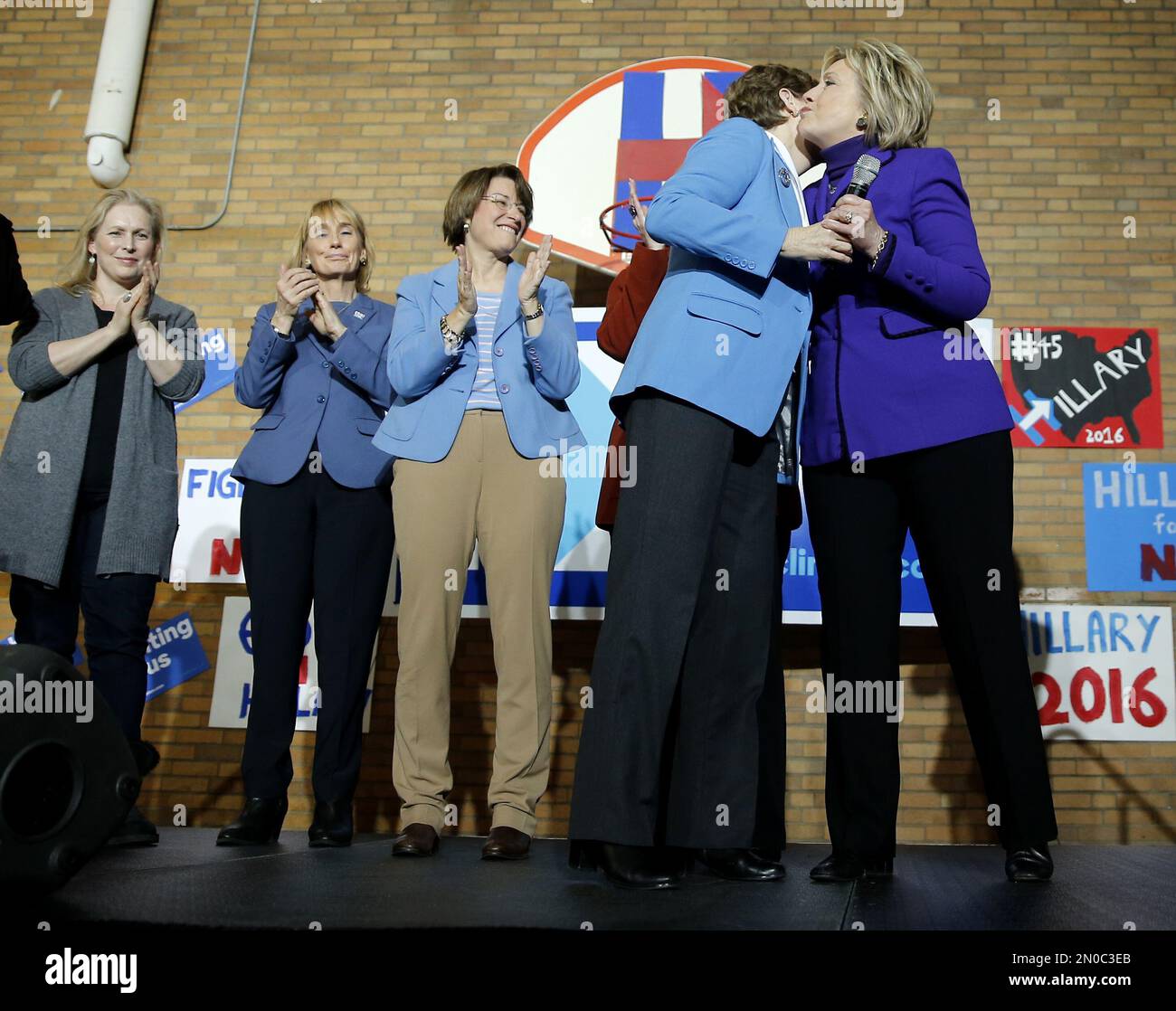 Democratic presidential candidate Hillary Clinton gets a hug from Sen ...