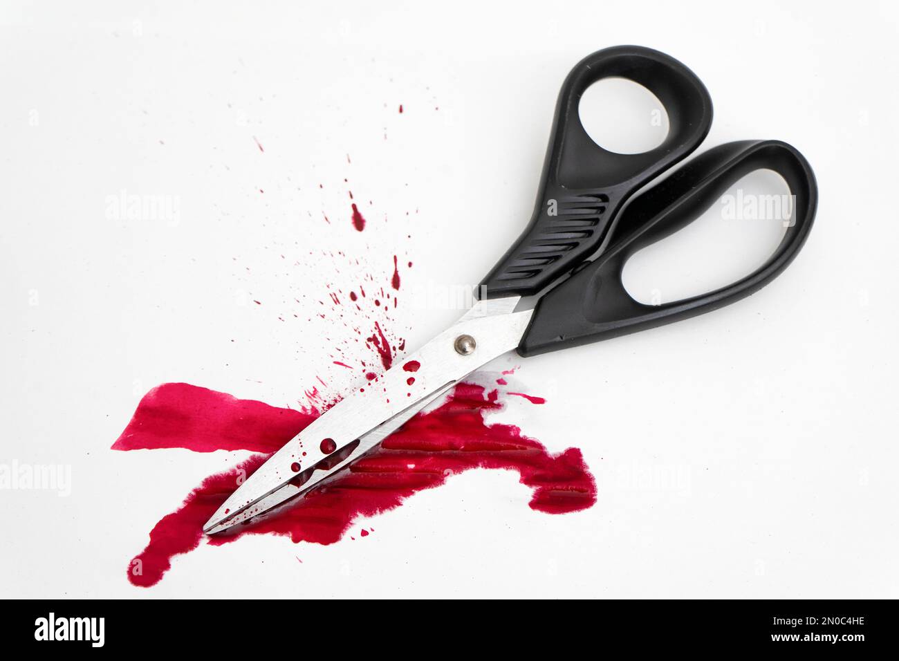 Bloody scissors in a pool of blood. Murder Attack Concept. Isolated on ...