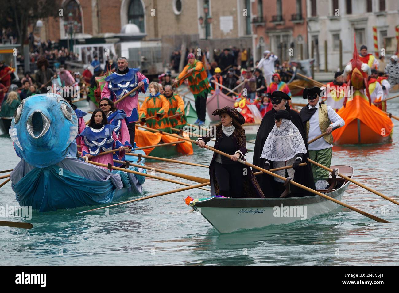 Performers wearing costumes during the “ Pantegana Regatta “ of the ...