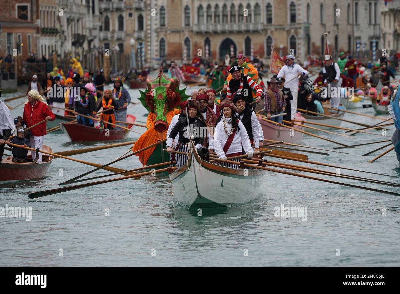 Performers wearing costumes during the “ Pantegana Regatta “ of the ...