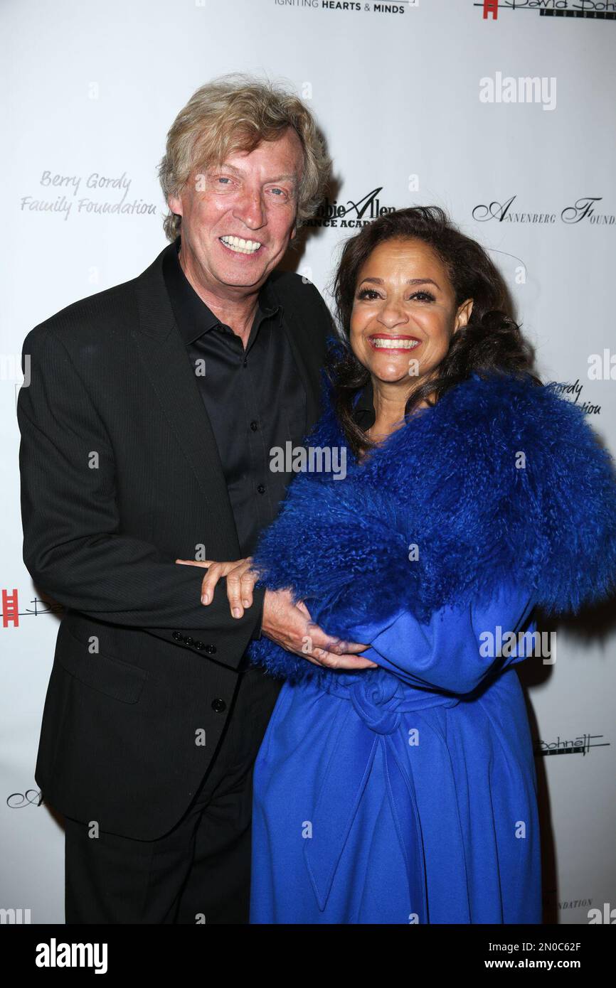 Nigel Lythgoe, left, and Debbie Allen arrive at the "Freeze Frame" Gala ...