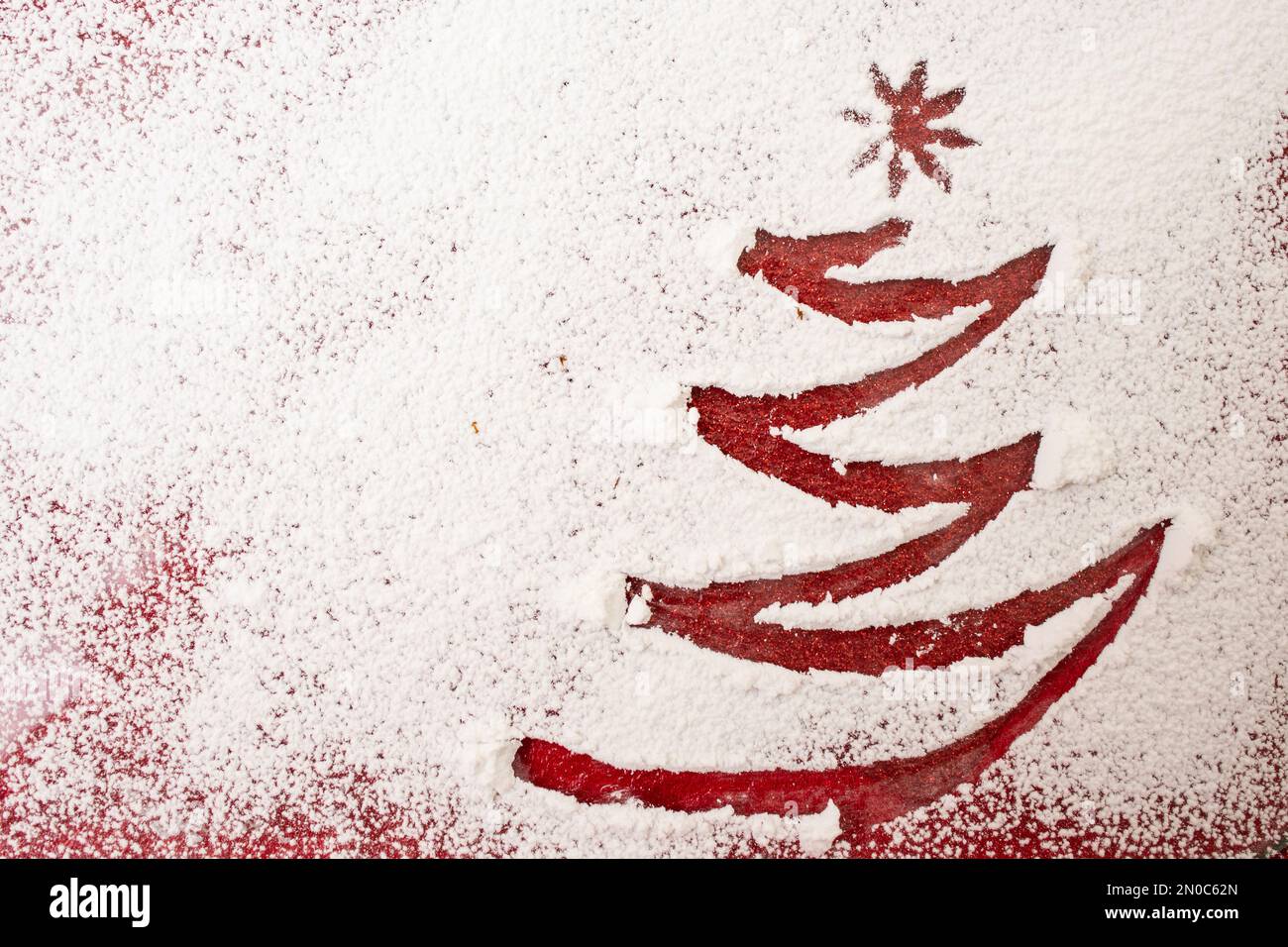 Christmas tree finger draw, on powder sugar, minimal holiday background ...