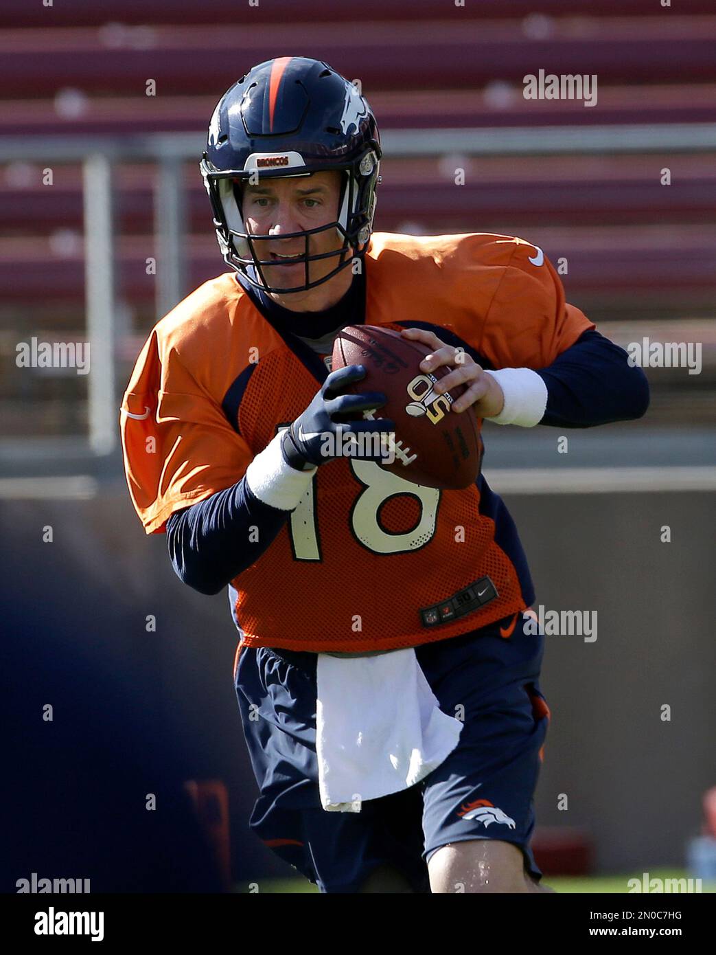 Denver Broncos quarterback Peyton Manning (18) rolls out to pass during ...