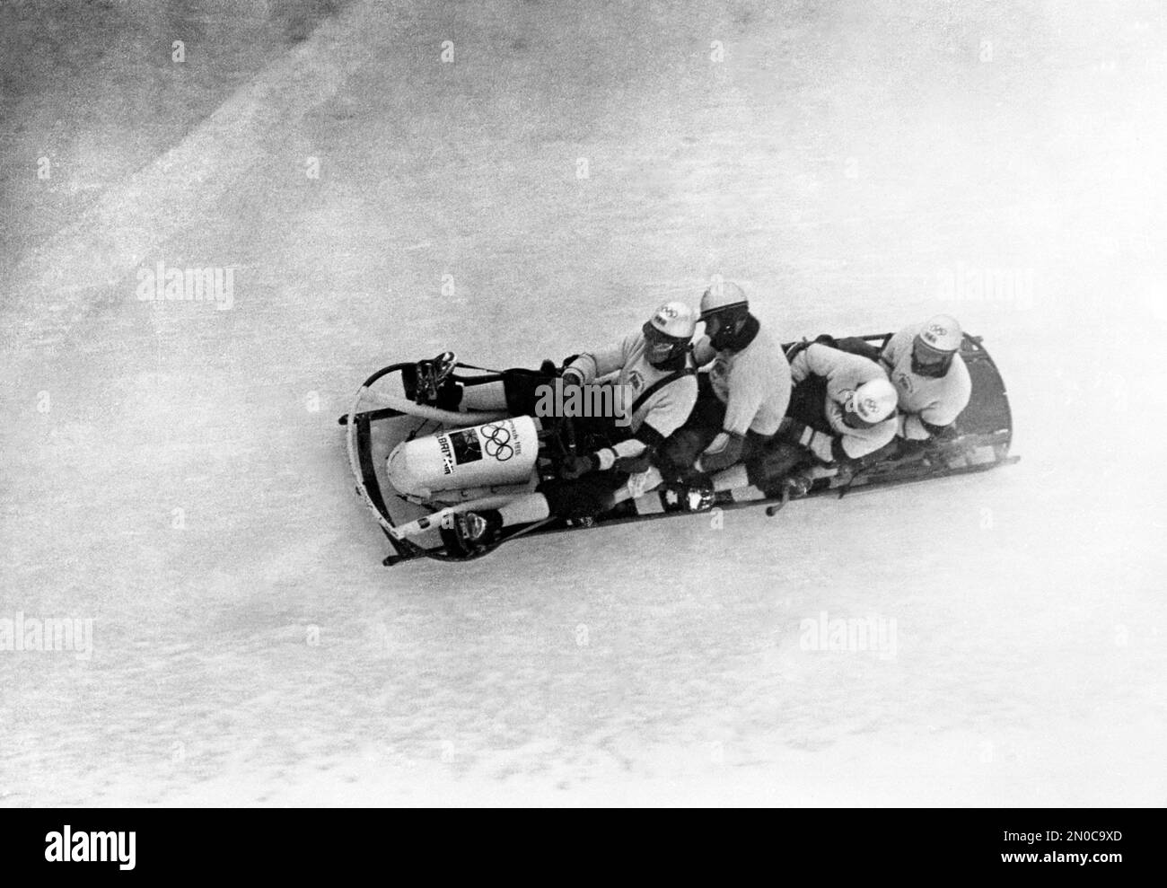 Macevoy, the English bob racer, steered his four-men sled, manned by ...