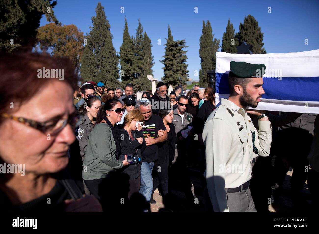 Israeli border police officer carry the coffin as of Hadar Cohen, an ...