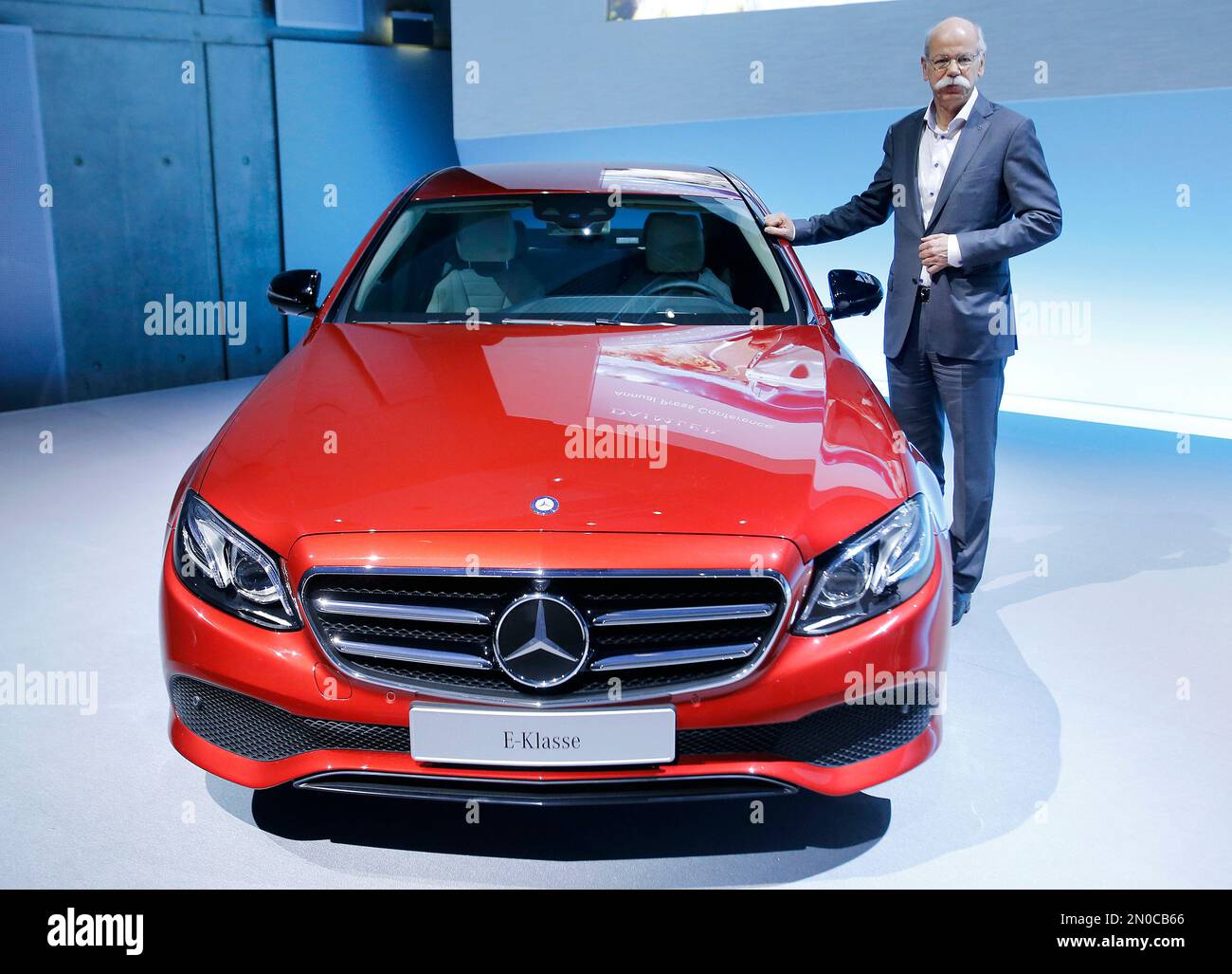 CEO of Daimler AG Dieter Zetsche stands next to a Mercedes E-class at ...
