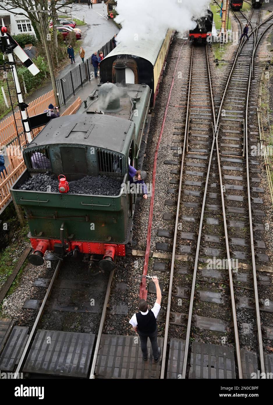 The fireman of GWR pannier tank No 6430 is about to collect the single ...