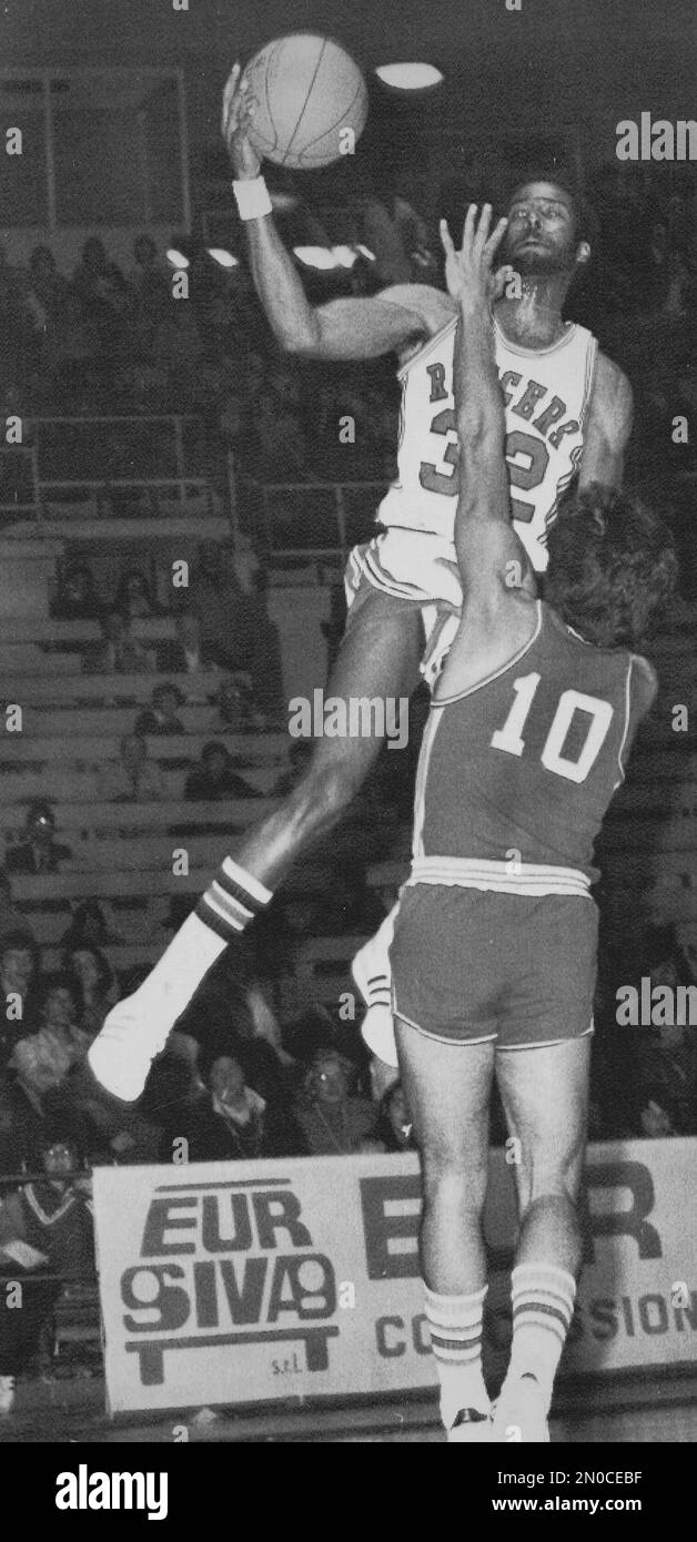 Mike Dabney of Rutgers University soars above Luis Brignoni of Puerto ...