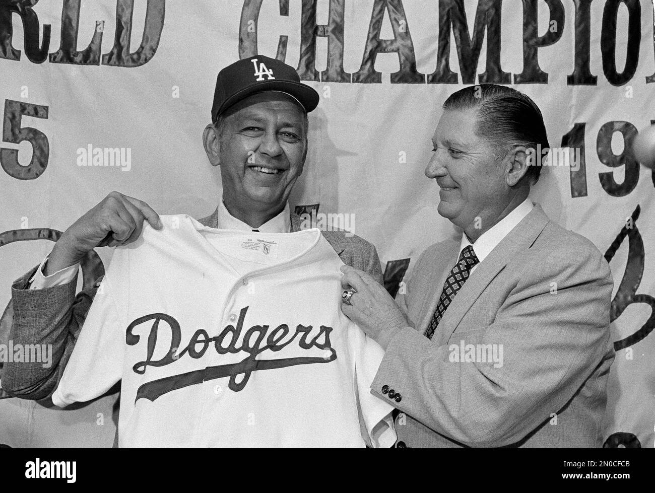 Former Philadelphia Phillies manager Danny Ozark, left, dons a Los ...