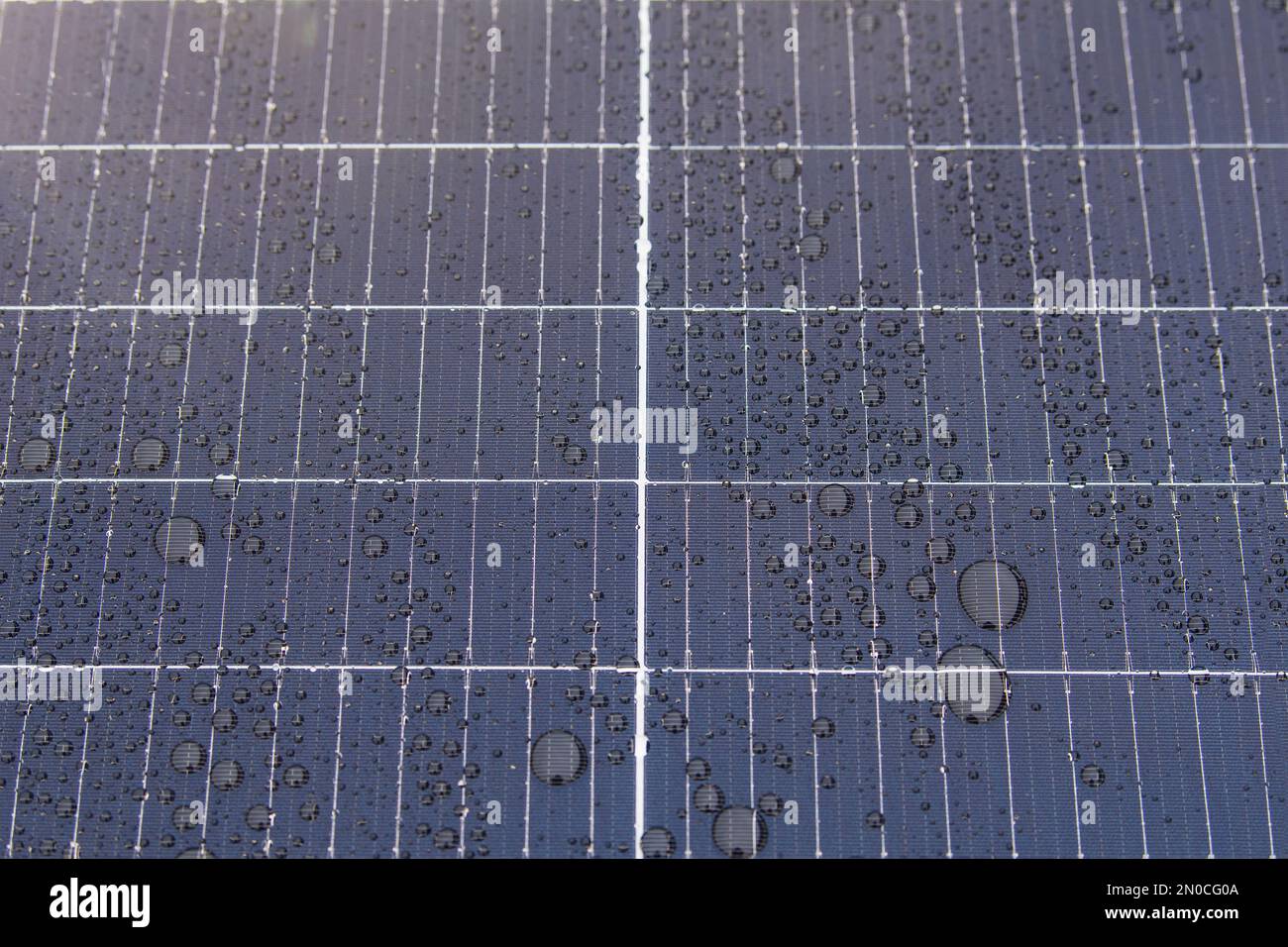 Green energy. Solar panels with raindrops close up. The use of ...