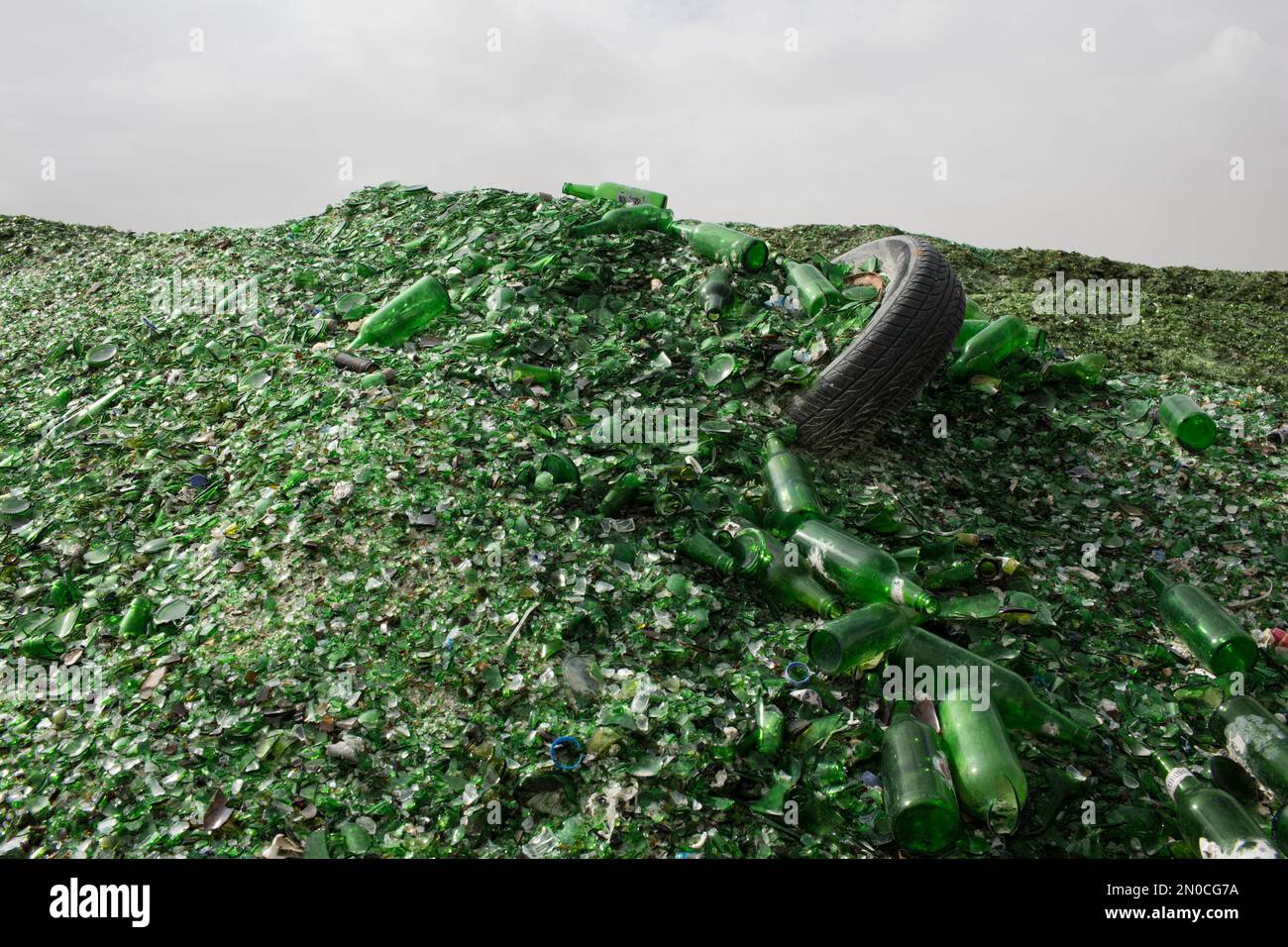 In this Sunday, Jan. 24, 2016 photo, broken glass bottles later to be ...